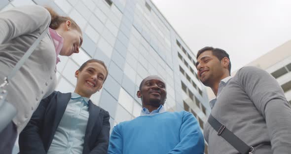 Low Angle View of Diverse Business People Looking Down at Camera and ...