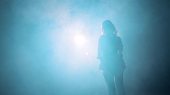 Woman dancing in the fog, Stock Footage | VideoHive