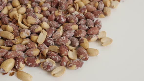 Salted snack Arachis hypogaea close-up 4K 2160p 30fps UltraHD tilting ...