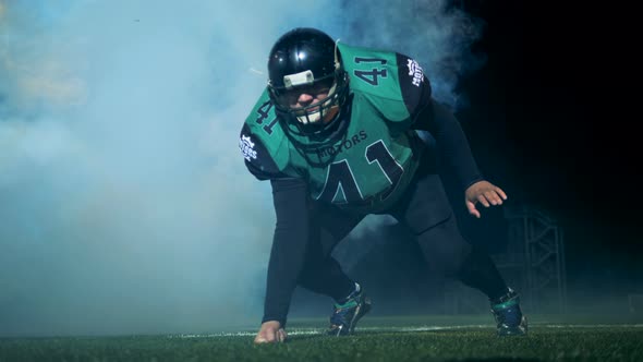 Male American Football Player Is Preparing To Run and Starts Running ...