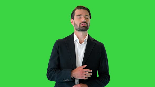 Young Handsome Business Man Walking and Talking To Himself on a Green ...