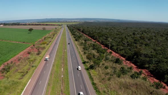 Highway runing through rural Brazil with sparse traffic - aerial view ...