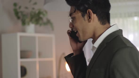 Young businessman having a phone call, positive motivation gestures ...