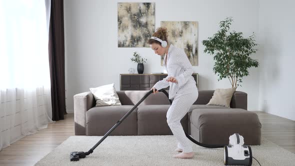 Young Cheerful Woman Dancing With Vacuum Cleaner While Cleaning Living ...