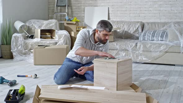 Man Reading Assembling Manual, Stock Footage | VideoHive