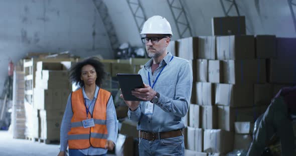Warehouse Supervisor Overseeing Staff, Stock Footage | VideoHive