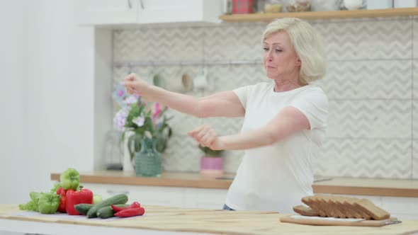 Healthy Senior Old Woman Dancing While Cooking in Kitchen, Stock Footage