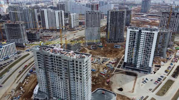 Flying over the construction site of a huge residential block of ...