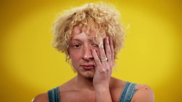 Headshot Portrait of Androgynous Queer Man Touching Face Looking at ...