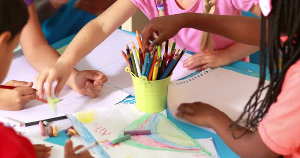 Preschool class drawing at table in classroom, Stock Footage | VideoHive