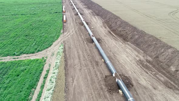 Aerial view of gas and oil pipeline construction. Pipes welded together ...