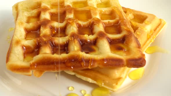 Preparation of waffles. Waffles are watered with honey., Stock Footage