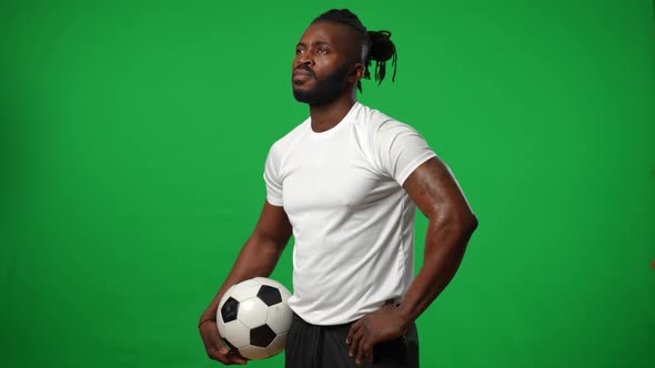 Sweating Tattooed Footballer with Ball Standing at Chromakey Background ...