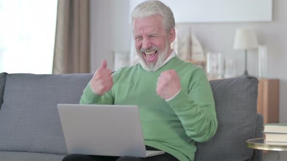 Old Man Celebrating Success on Laptop at Home, Stock Footage | VideoHive