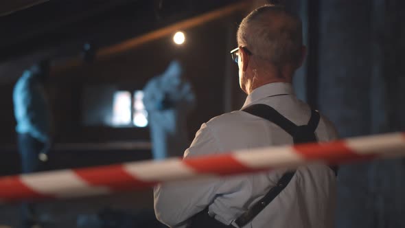 Back View of Detective Watching Forensic Specialists Examining Dead ...