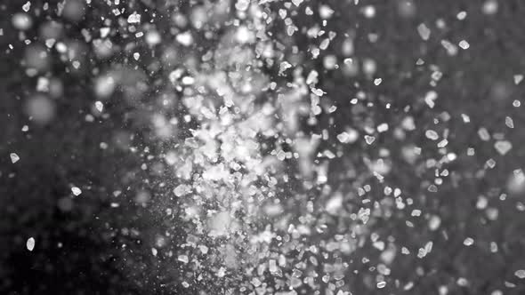Super Slow Motion Shot of Salt Falling on Black Background at 1000Fps ...