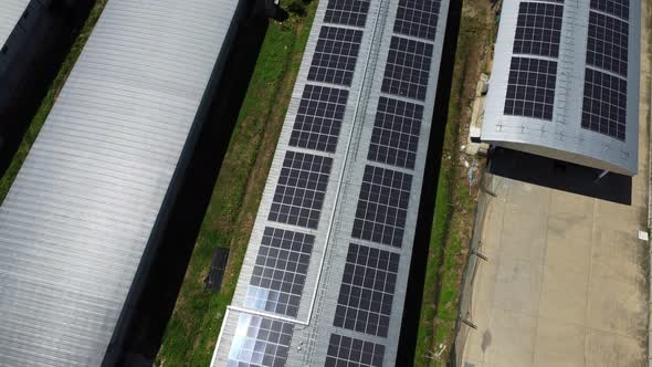 Aerial view of Solar panels installed on a roof of a large industrial ...