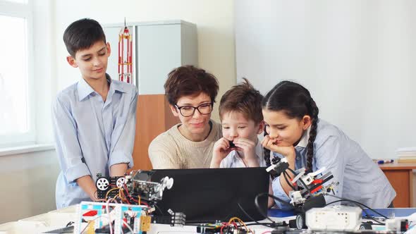 Happy Children Learn Programming Using Laptops on Extracurricular ...