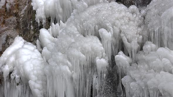 Waterfall Flowing Behind Ice Wall, Stock Footage | VideoHive