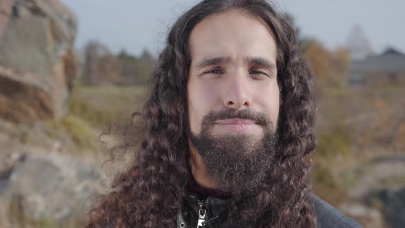 Close-up Face of Handsome Middle Eastern Man with Long Black Hair and ...
