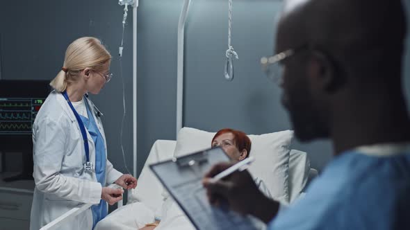 Doctor Interviewing Patient and Nurse Taking Notes, Stock Footage ...