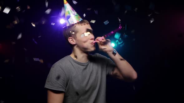 Guy Throwing Glitter Confetti, Blowing Party Whistle and Dance. Close ...