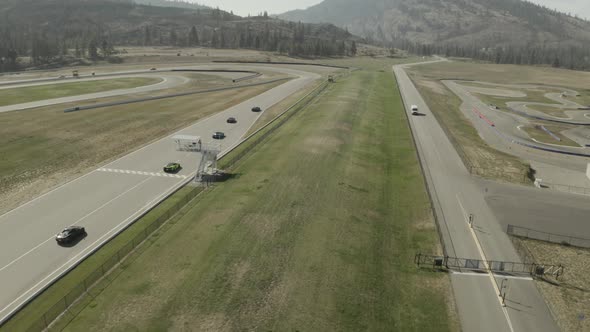 Exotic sports cars driving on a racing circuit, Osoyoos race track ...