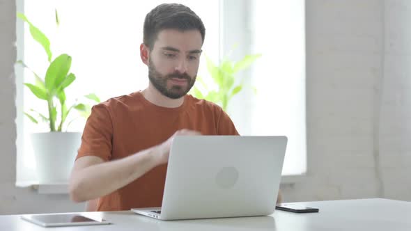 Young Man Standing Up and Going Away After Closing Laptop, Stock Footage