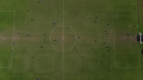 Birdseye Aerial View of Football Grass Field and Players on a Training ...