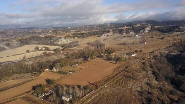 Aerial view of rural area with flat dry land crossed by country roads ...