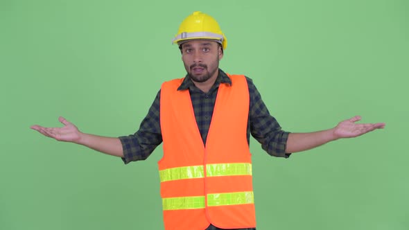 Confused Young Bearded Persian Man Construction Worker Shrugging ...