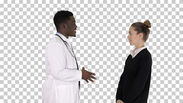 Male african doctor talking to female patient, Alpha Channel, Stock Footage