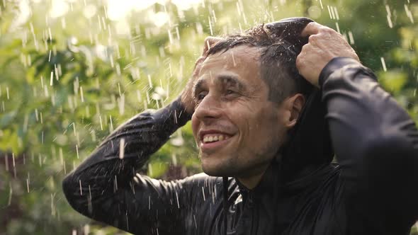 Cheerful Young Man Under Rain, Stock Footage | VideoHive