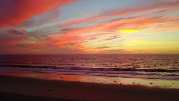 Aerial drone view of a sunset at the beach over the ocean., Stock Footage