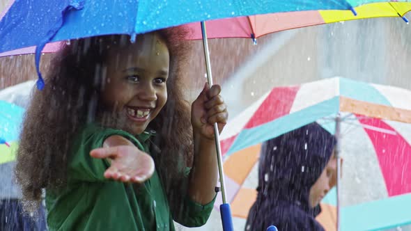 Laughing Little Girl Catching Raindrops, Stock Footage | VideoHive