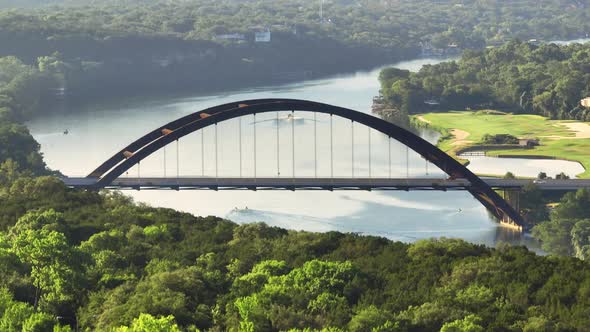 Rising up to reveal Pennybacker 360 bridge in Austin, Texas over Lake ...