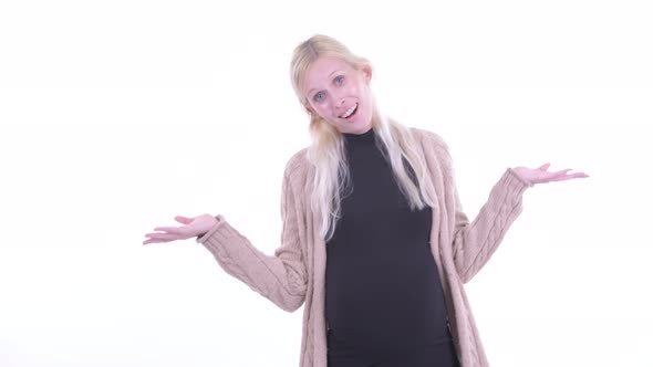 Happy Young Blonde Pregnant Woman Shrugging Shoulders, Stock Footage