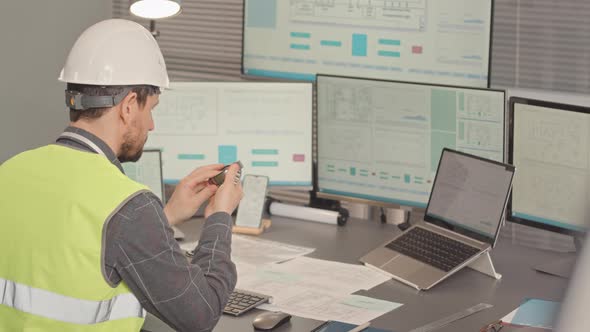 Industrial Engineer Working with Technology Schemes in Office, Stock ...