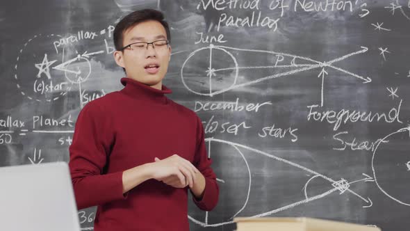 Asian Physicist Presenting New Project at Chalkboard, Stock Footage
