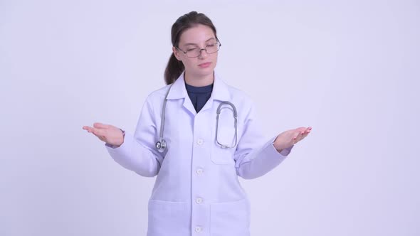 Serious Young Woman Doctor Shrugging Shoulders, Stock Footage | VideoHive