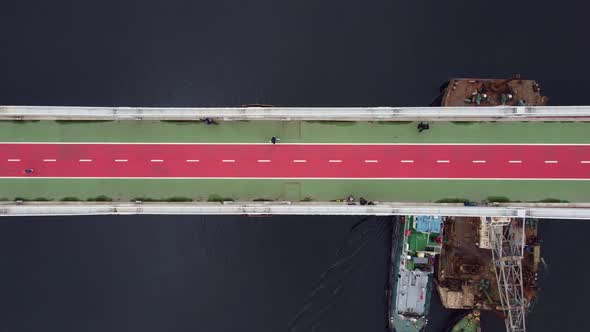 Pedestrian Bridge with a Bike Path Across the River in Kiev, Stock Footage