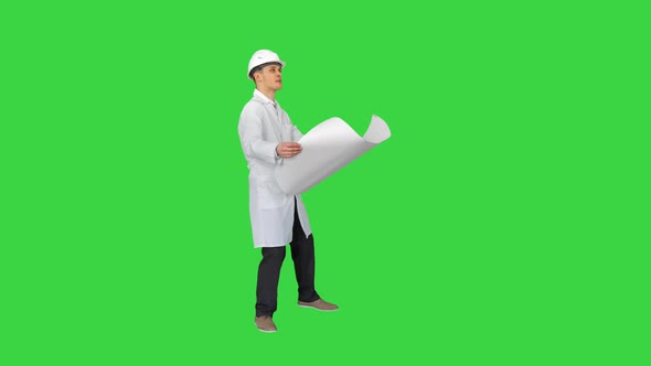 Engineer Dancing with a Blueprint Being in a Good Mood on a Green ...