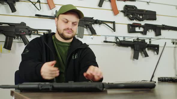 A Merchant Works Behind a Counter in an Arms Store, Stock Footage ...