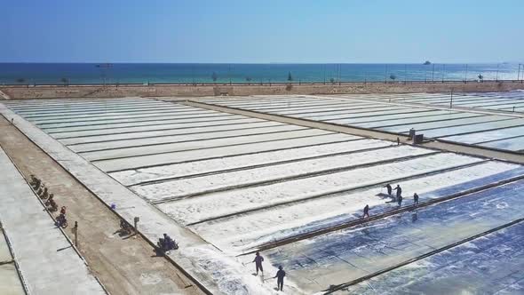 Local Workers Rake Salt on Plantations By Ocean, Stock Footage | VideoHive
