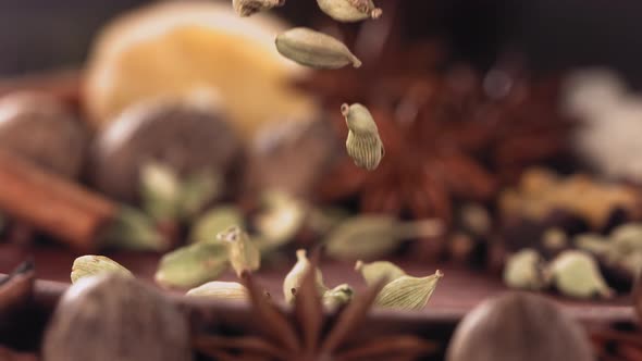 Cardamom Falling Among Spices on Wood, Stock Footage | VideoHive