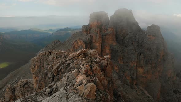 Aerial View of a Drone Flying Over Sharp Rocky Outcrops at Sunset ...