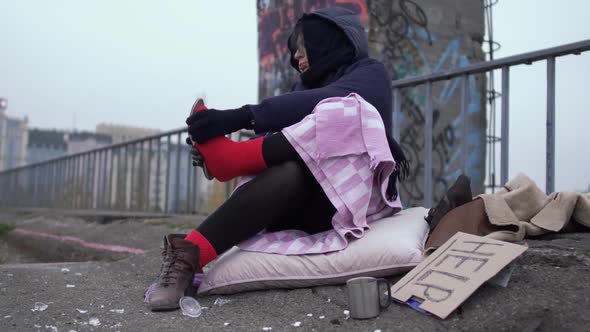 Homeless Woman Appreciate the Shoes Worn on a Thick Red Sock, Stock Footage