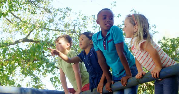 Kids pointing towards a distant in the playground 4k, Stock Footage