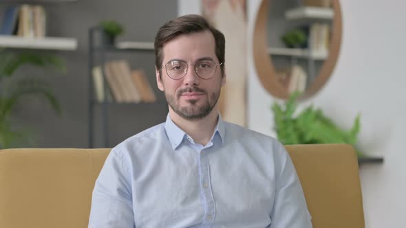 Portrait of Young Man Looking at Camera at Home, Stock Footage | VideoHive