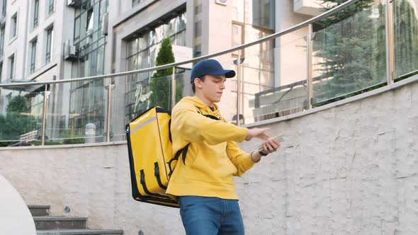 Funny Delivery Man Throwing Money and Dancing on the Stairs, Stock Footage